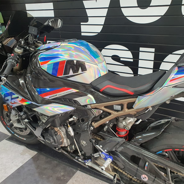 Why is vinyl wrap the ideal material for customizing motorcycles?
